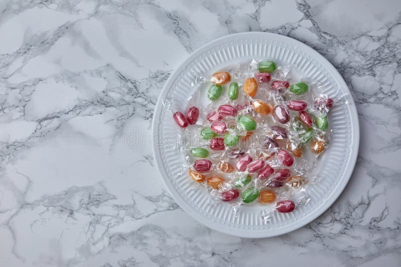 Colorful Candies in Plate on a Kitchen Table Stock Image - Image of ...