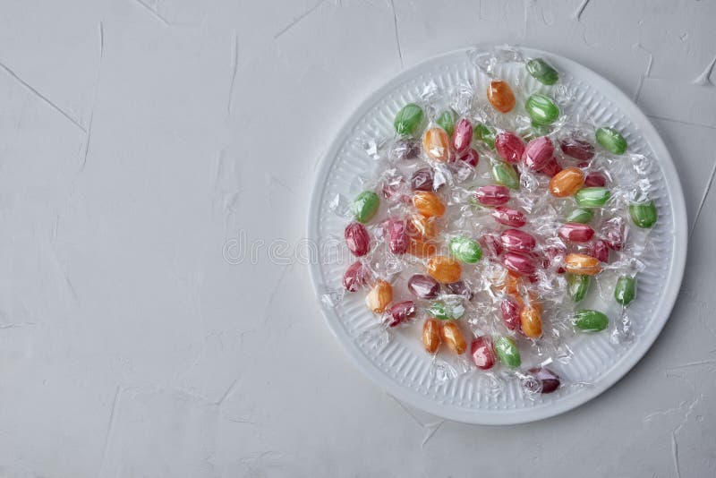 Colorful Candies in Plate on a Kitchen Table Stock Image - Image of ...