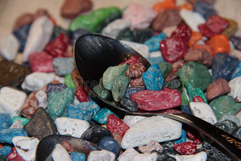 Colorful Candies on a Spoon. Chocolate in the Form of Stones Stock ...