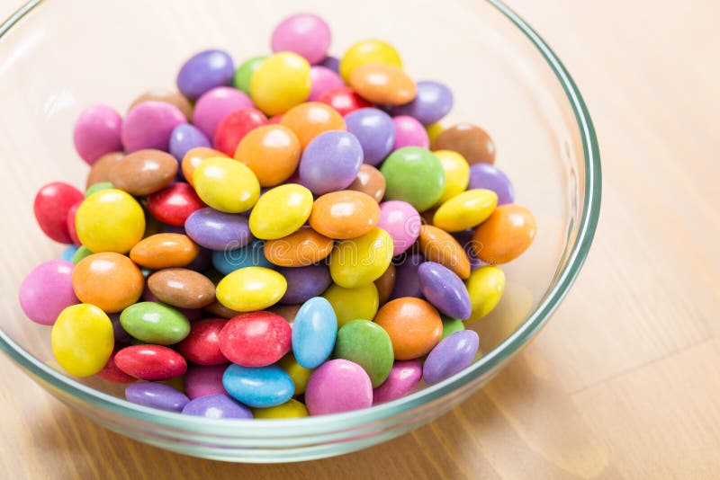 Colorful candy in bowl stock photo. Image of orange, confectionery ...