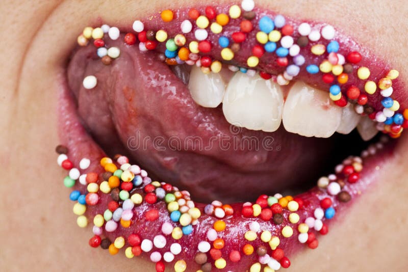 Colorful candy on red lips stock image. Image of woman - 105982955