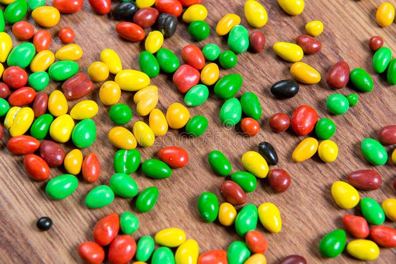 Colorful Candy Scattered on the Wooden Table. Stock Image - Image of ...