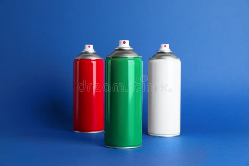 Colorful Cans of Spray Paints on Blue Background Stock Photo - Image of ...