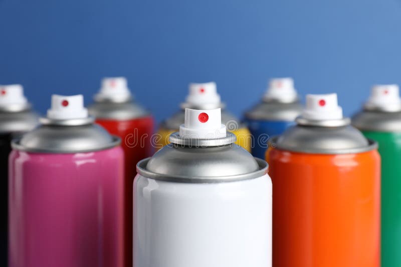 Colorful Cans of Spray Paints on Red Background Stock Image - Image of ...
