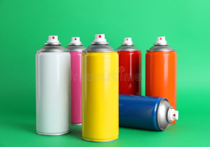 Colorful Cans of Spray Paints on Green Background Stock Image - Image ...