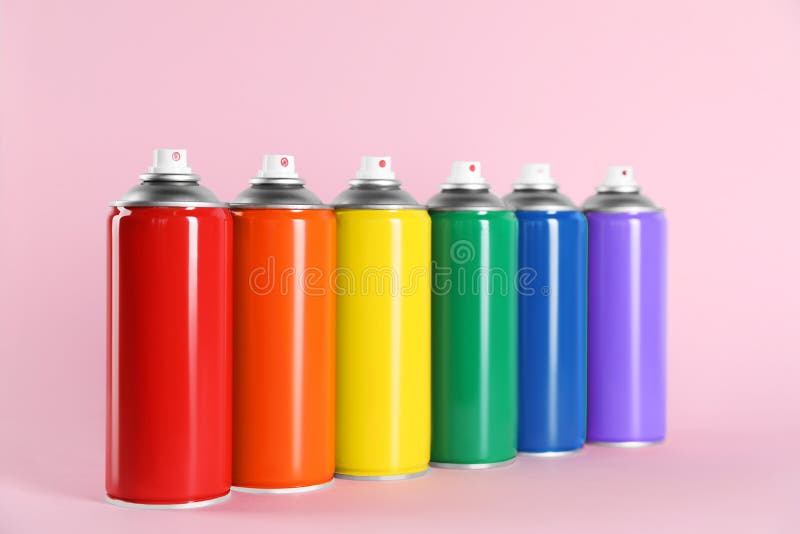 Colorful Cans of Spray Paints on Pink Background Stock Image - Image of ...