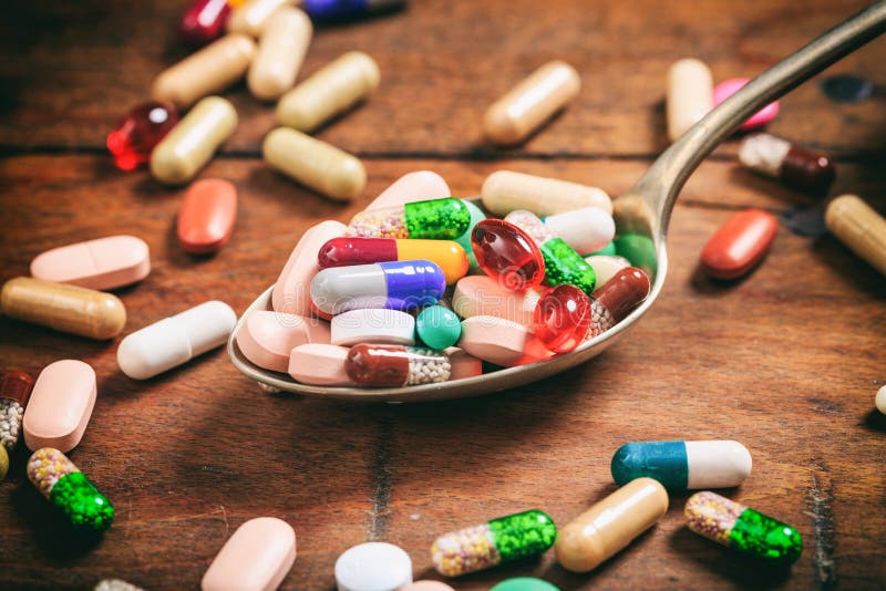 Colorful Capsules in Blue Container Stock Image - Image of cure ...