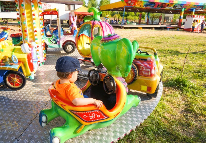Child Sitting on a Carousel Editorial Stock Photo - Image of child ...