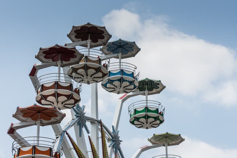 Colorful Carousel with View Up To the Clouds on the Sky in a Amusement ...