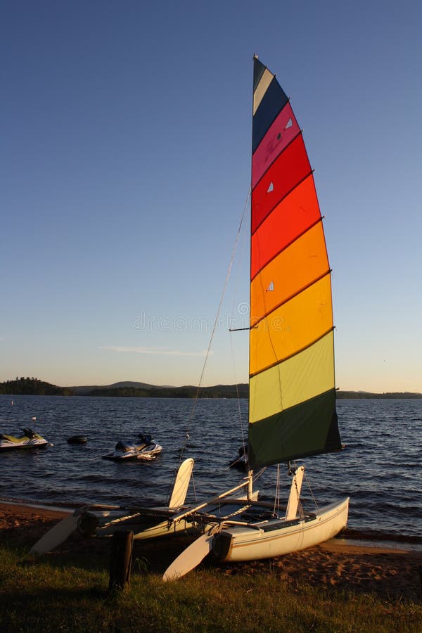 Colorful Catamaran on Lake Beach Stock Photo - Image of vessel, boat ...