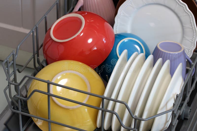 Colorful Ceramic Plates and Bowls Inside Dishwasher Basket Getting ...