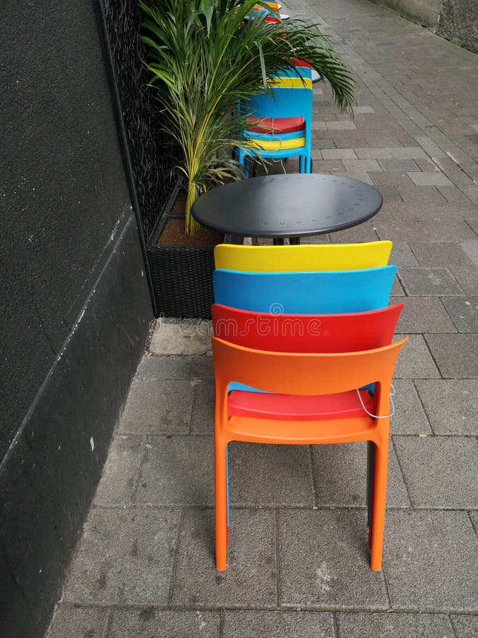 Colorful Chairs in the Cafe Stock Image - Image of modern, glass: 192619057