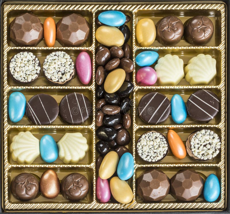 Colorful chocolates in box stock image. Image of assortment - 85601337