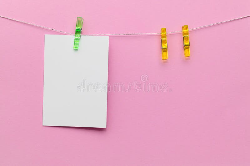 Colorful Clips Hold a Blank Note Against a Pink Background for Creative ...