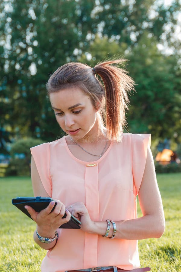 Colorful Close Up of Girl Using Tablet in the Park Stock Photo - Image ...