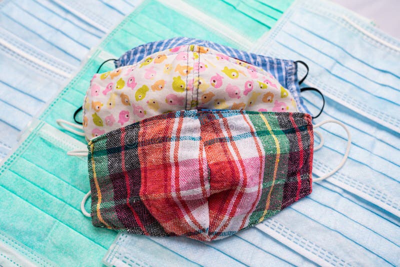 Colorful Cloth Face Masks on Surgical Mask Pattern Background Stock ...