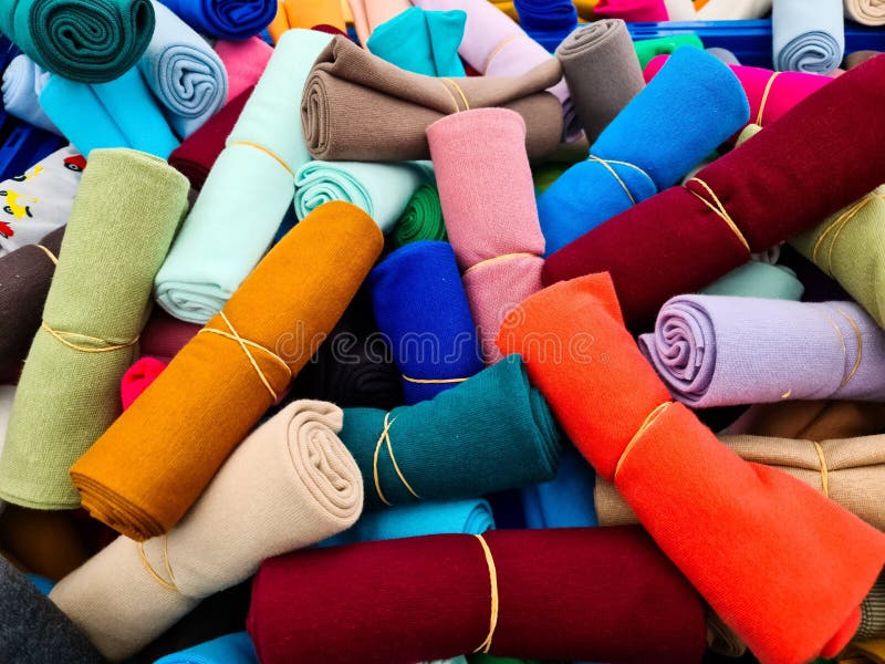 Colorful Cloth Rolls Forming a Vibrant Textile Background Stock Photo ...