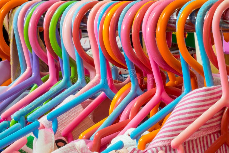 Colorful clothes hangers stock photo. Image of garment - 66680958