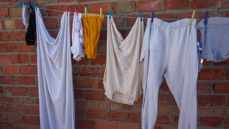Colorful Clothes Hanging on the Laundry Rope Stock Photo - Image of ...