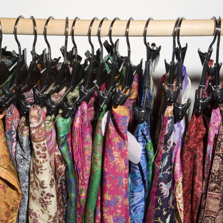 Colorful clothes on rack. stock photo. Image of bright - 2431316