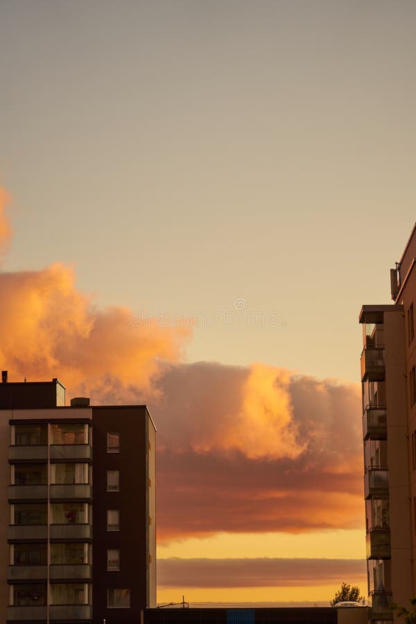 Colorful Clouds Behind a Multi-storey Building at Sunset. Stock Image ...