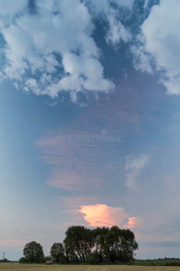 Colorful clouds over field stock photo. Image of rural - 146025974