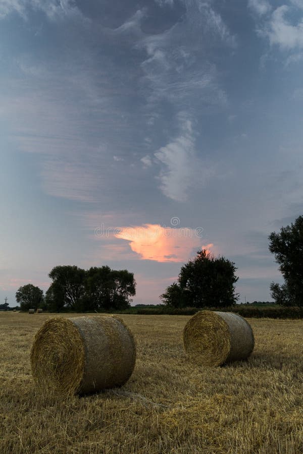 Colorful clouds over field stock image. Image of thunder - 146025991
