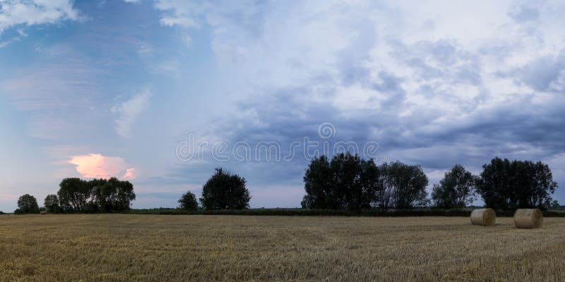 Colorful clouds over field stock image. Image of clouds - 146026091