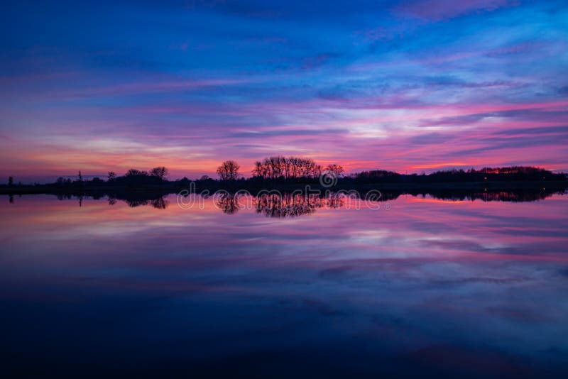 Colorful Clouds after Sunset and Reflection in the Water Stock Image ...