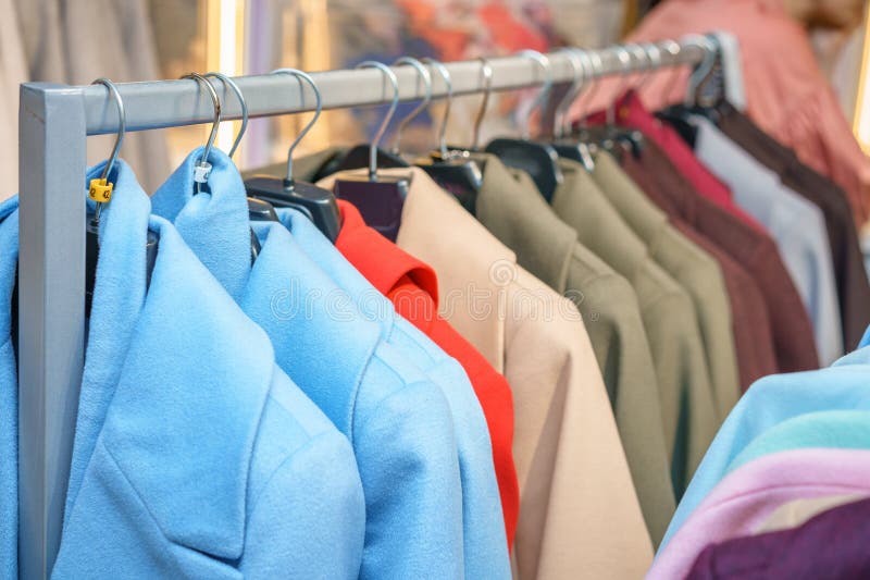 Colorful Coats Hanging on Hangers in the Store Stock Image - Image of ...