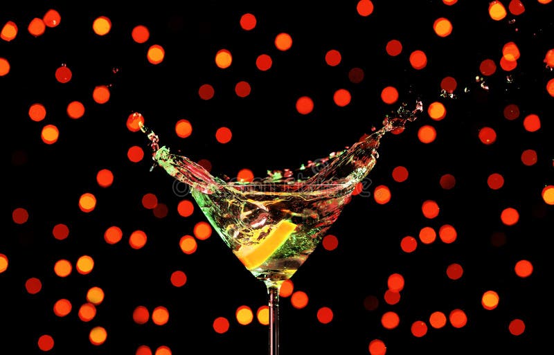 Cocktail with Splash on Blurred Lights Background Stock Image - Image ...