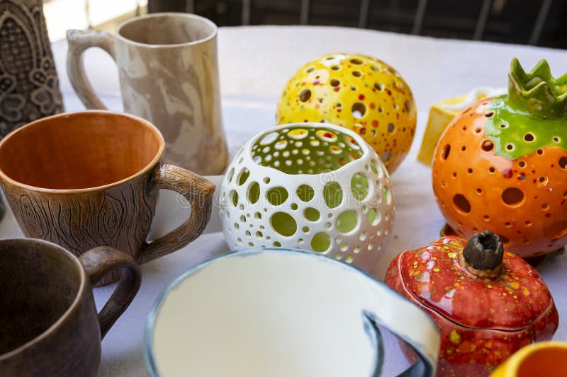 A Colorful Collection of Handcrafted Ceramic Mugs and Decorative Pieces ...