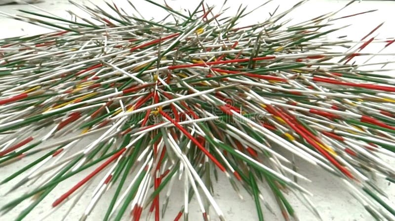 A Colorful Collection of Painted Sticks Lying Haphazardly on a Surface ...