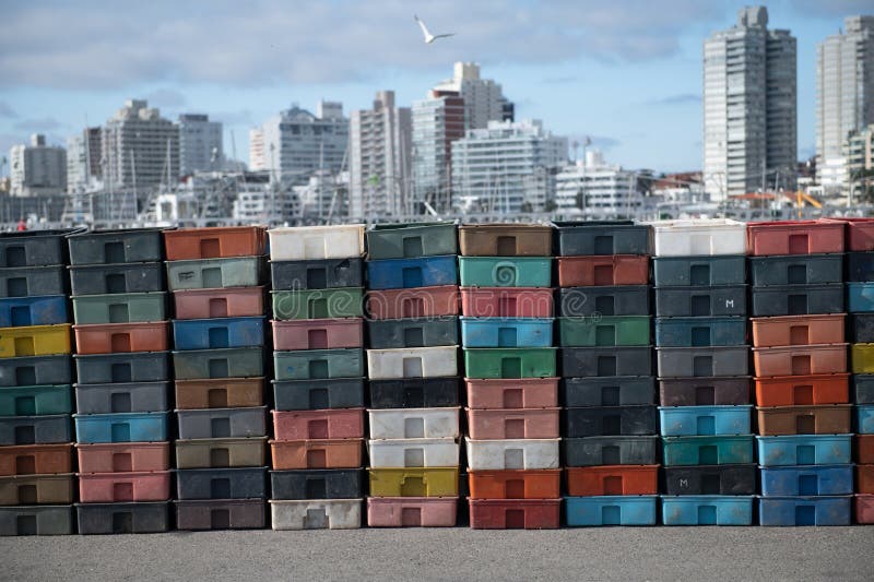 Colorful Containers Stacked with City Skyline Under Partly Cloudy Sky ...
