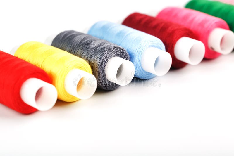 Sewing Threads of Different Colors on Reels on a White Background. Free ...