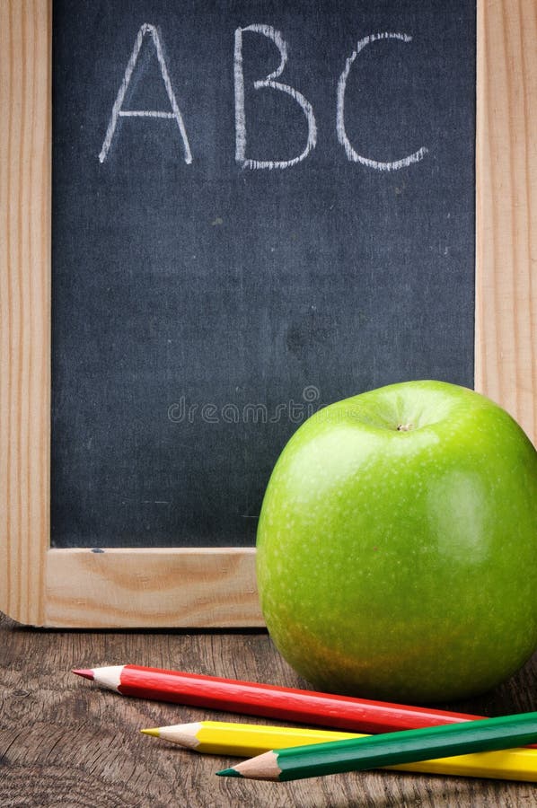 Colorful crayons and apple stock image. Image of chalk - 26201201