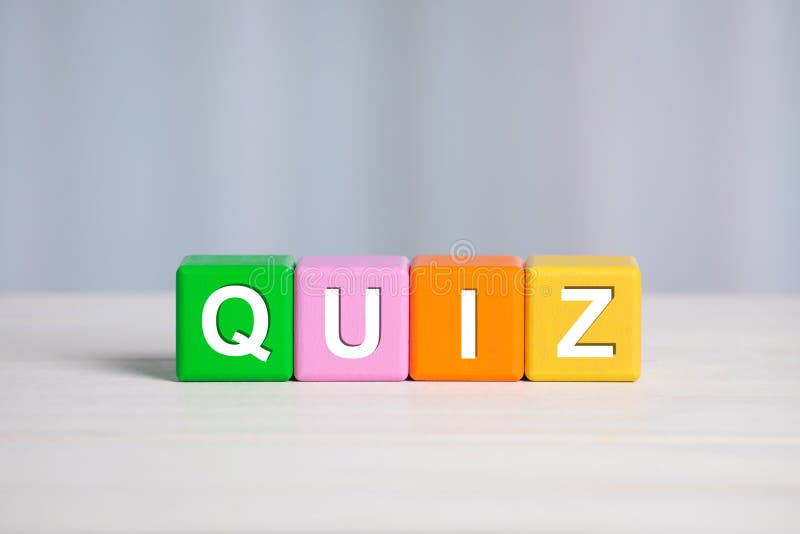 Colorful Cubes with Word Quiz on White Wooden Table. Space for Text ...