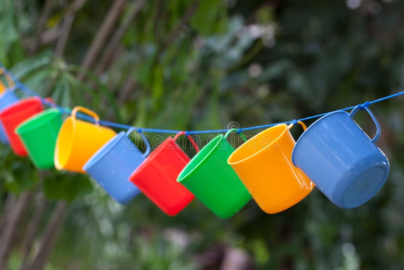 The colorful cup on rope stock photo. Image of blue, water - 45636726