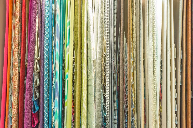 Colorful Curtain Samples Hanging from Hangers on a Rail in a Dis Stock ...