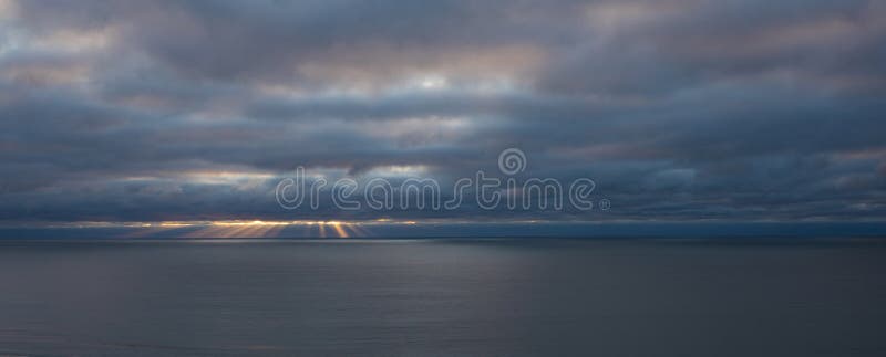 Colorful Dawn at Myrtle Beach with Light Sneaking through Clouds Stock ...
