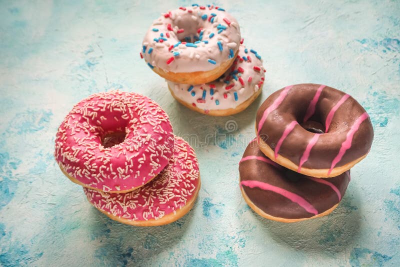 Colorful Donuts on Blue Stone Table. Top View Stock Photo - Image of ...