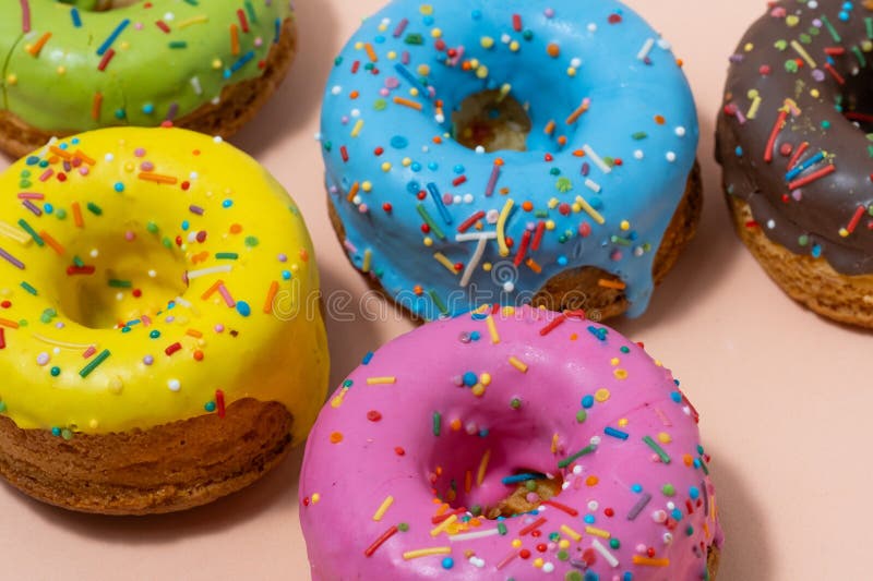 Colorful Donuts on Pink Background. Closeup Stock Photo - Image of ...