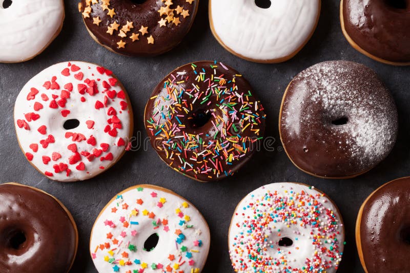 Colorful donuts stock image. Image of chocolate, table - 72557151