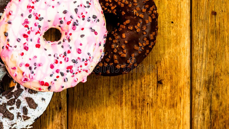 Colorful Donuts on Table with Copy Space. Top View of Glazed Doughnuts ...