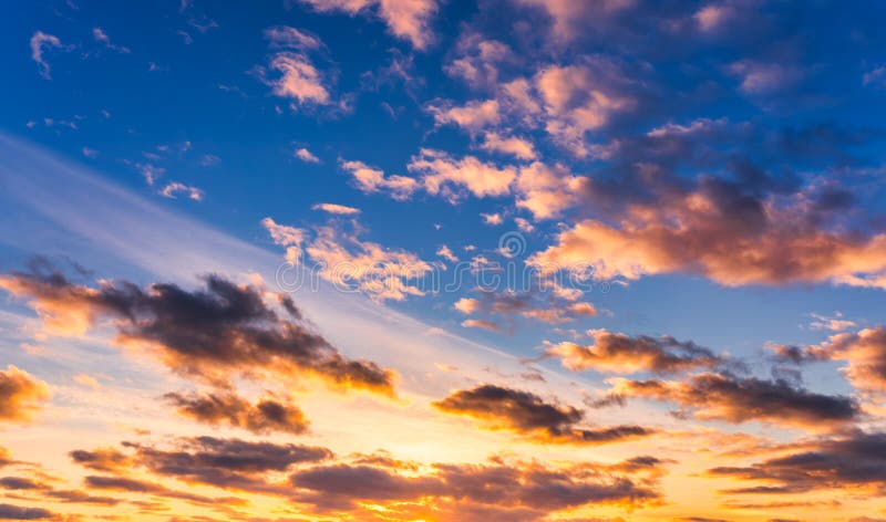 Colorful Dramatic Clouds Lit by a Sun Against the Sunset or Sunrise ...