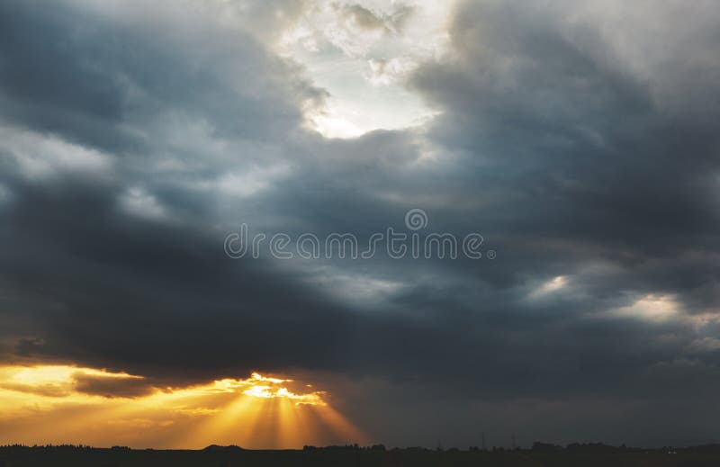 Colorful Dramatic Sky with Sunbeams and Heavy Clouds at Sunset Stock ...