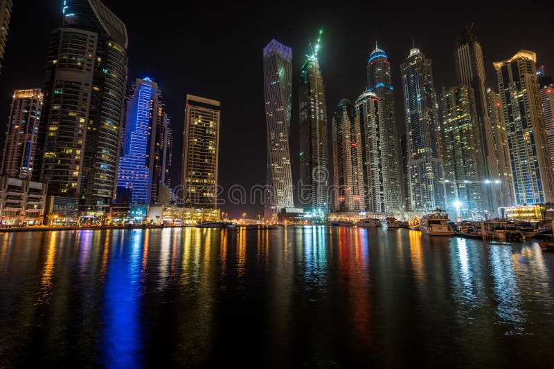 Dubai Skyline at Night with Colorful Reflections on the Water Editorial ...