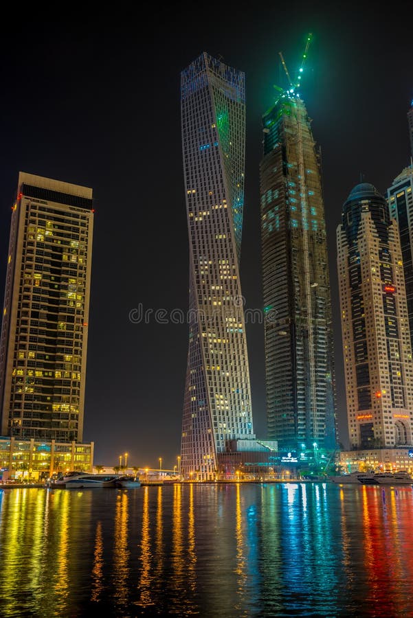 Dubai Skyline at Night with Colorful Reflections on the Water ...