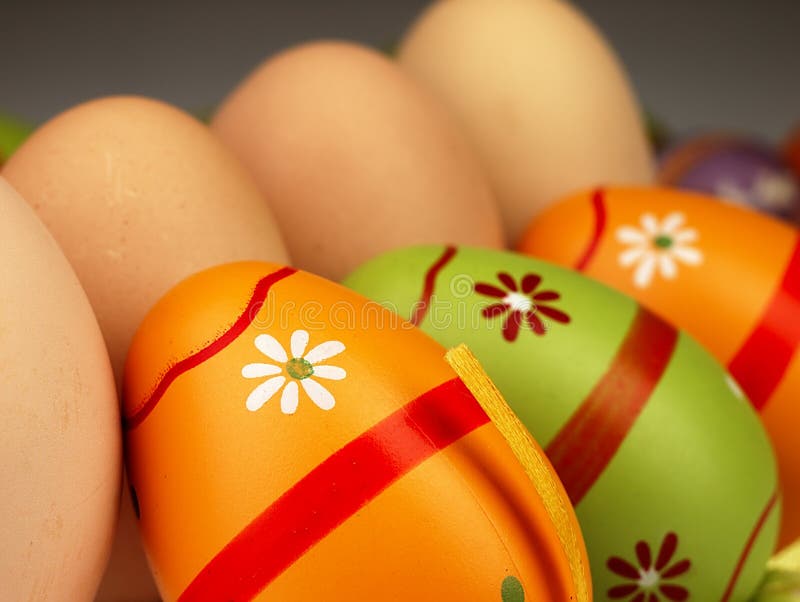 Colorful Easter Egg in the Company of Ordinary Eggs. Stock Photo ...