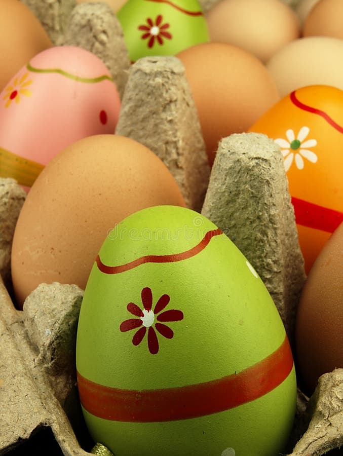 Colorful Easter Eggs in the Company of Ordinary Eggs. Stock Image ...